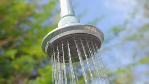 A tropical outdoor shower with water flo... | Stock Video | Pond5