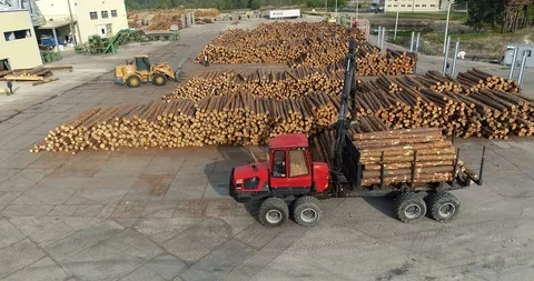Truck with a crane loads logs, loading l... | Stock Video | Pond5