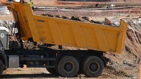 Truck unloading earth in the process of ... | Stock Video | Pond5