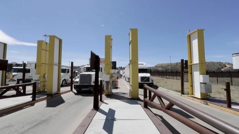 Trucks arriving at port of entry checkpo... | Stock Video | Pond5