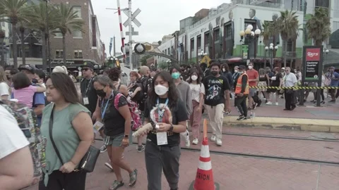 Trying to walk through dense crowd cross... | Stock Video | Pond5