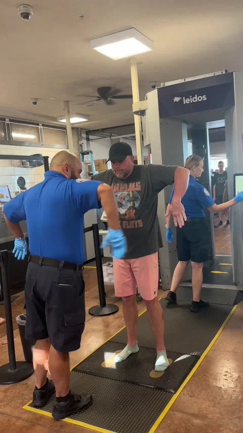 TSA Agent Makes Man Do the Robot, Maui, ... | Stock Video | Pond5