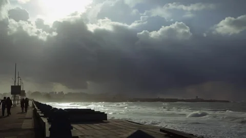 Tsunami hits Alexandria, people walking ... | Stock Video | Pond5