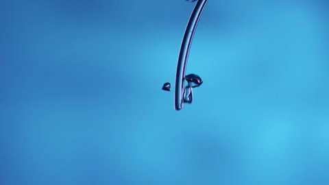 Tube forming air bubbles in calm blue wa... | Stock Video | Pond5
