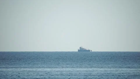 Tug boat in open calm sea, heading back ... | Stock Video | Pond5