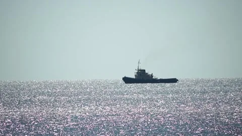 Tug boat in open calm sea, heading back ... | Stock Video | Pond5