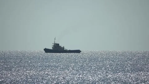 Tug boat in open calm sea, heading back ... | Stock Video | Pond5
