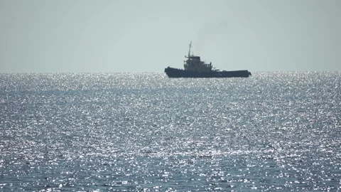 Tug boat in open calm sea, heading back ... | Stock Video | Pond5