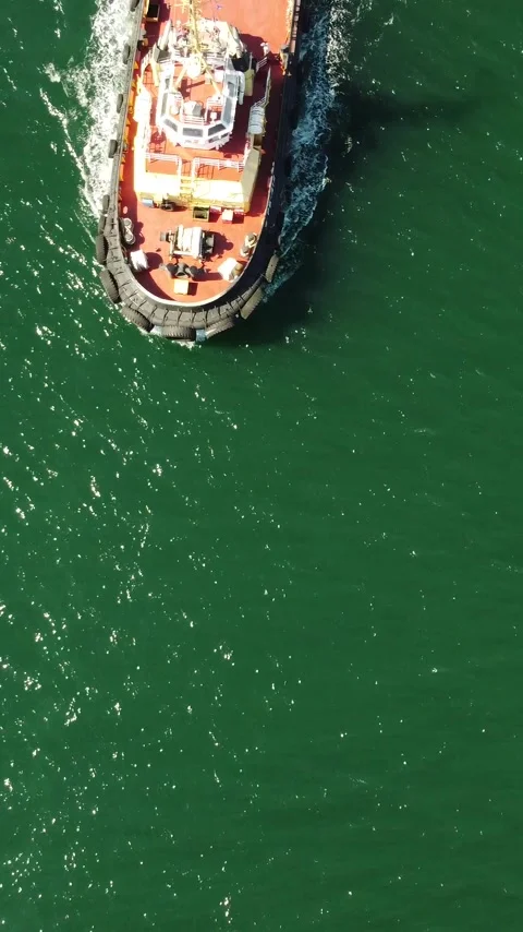 Tug boat in open calm sea, heading back ... | Stock Video | Pond5