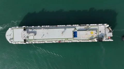 Tug boats pulling a large RoRo ship into... | Stock Video | Pond5