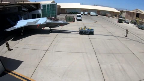 Tug towing F-35A Lightning II Aggressor ... | Stock Video | Pond5