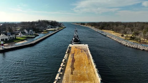 A tugboat pulling a barge and headed out... | Stock Video | Pond5