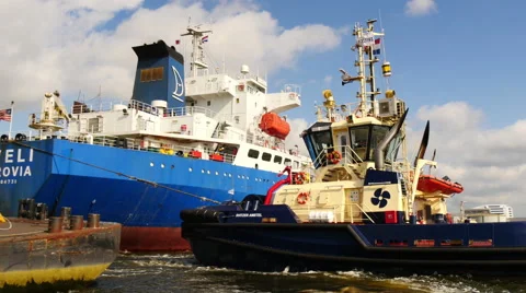 Tugboat pulling ship Kiveli from the qua... | Stock Video | Pond5