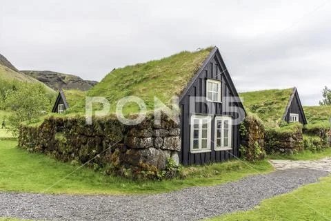 Turf houses built in traditional manner Stock Image #150012296