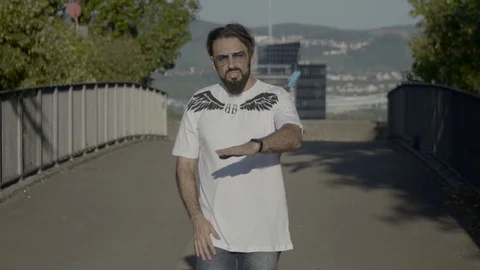 A turkish rapper performing on a bridge.... | Stock Video | Pond5
