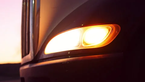 Turn signal blinks on semi truck at dawn... | Stock Video | Pond5