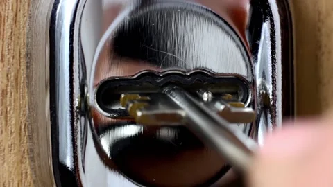 Turning the key in the keyhole close up ... | Stock Video | Pond5