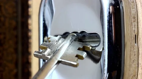 Turning the key in the keyhole close up ... | Stock Video | Pond5