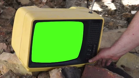 Turning on retro TV on broken bricks in ... | Stock Video | Pond5