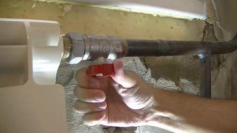 Turning the valve by hand on a metal pip... | Stock Video | Pond5