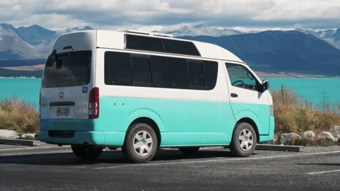 Turquoise camper van parked in front of ... | Stock Video | Pond5