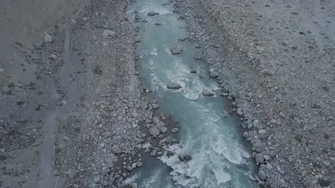 Turquoise River Flowing Past Rocks Throu... | Stock Video | Pond5