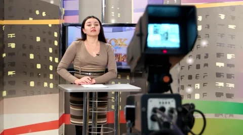 TV presenter reading news in the studio ... | Stock Video | Pond5