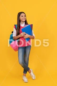 Photograph: Tween and youth. learning subject. young happy teen girl ...