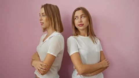 Twin women standing together against pin... | Stock Video | Pond5