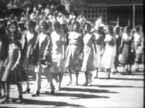 Twins walk in a pageant and pose, in Lon... | Stock Video | Pond5