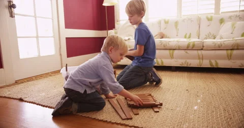 Two adorable young brothers building a m... | Stock Video | Pond5