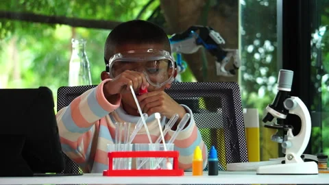 Two asia kids testing chemistry lab expe... | Stock Video | Pond5