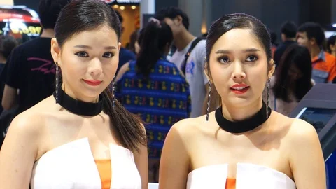 Two Asian Female Presenter Models At Int... | Stock Video | Pond5