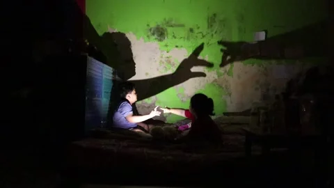 Two asian kids playing shadow in the bed... | Stock Video | Pond5