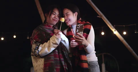 Two Asian siblings are video calling a f... | Stock Video | Pond5