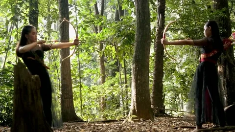 Two Asian women pull the arrow and place... | Stock Video | Pond5