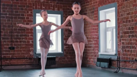 Two ballerina girls synchronized dancing... | Stock Video | Pond5