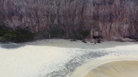 Two Beach Goers Relax. Colorful Cliffsid... | Stock Video | Pond5