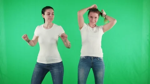 Two beautiful girls dancing and smiling ... | Stock Video | Pond5