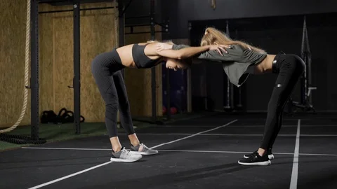 Two beautiful young women in the gym. Gi... | Stock Video | Pond5