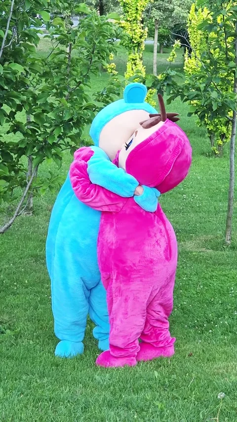 Two big dolls, a boy and a girl, hugging... | Stock Video | Pond5