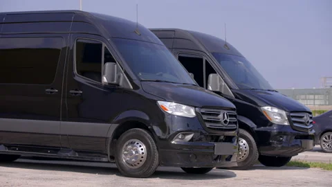 Two black Mercedes Sprinter limo vans pa... | Stock Video | Pond5