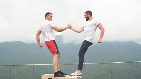 Two bodybuilders shake hands before star... | Stock Video | Pond5