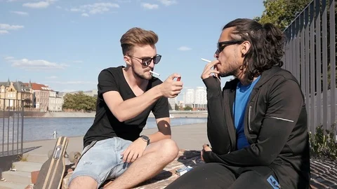Two Boys Friends smoking Cigarettes on a... | Stock Video | Pond5