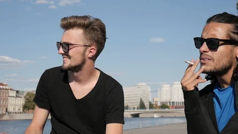 Two Boys Friends smoking Cigarettes on a... | Stock Video | Pond5