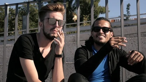 Two Boys Friends smoking Cigarettes on a... | Stock Video | Pond5