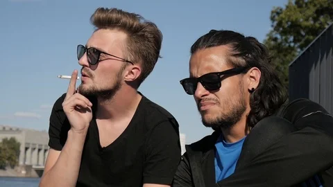 Two Boys Friends smoking Cigarettes on a... | Stock Video | Pond5
