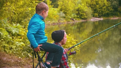 Two brothers on fishing - man holding th... | Stock Video | Pond5