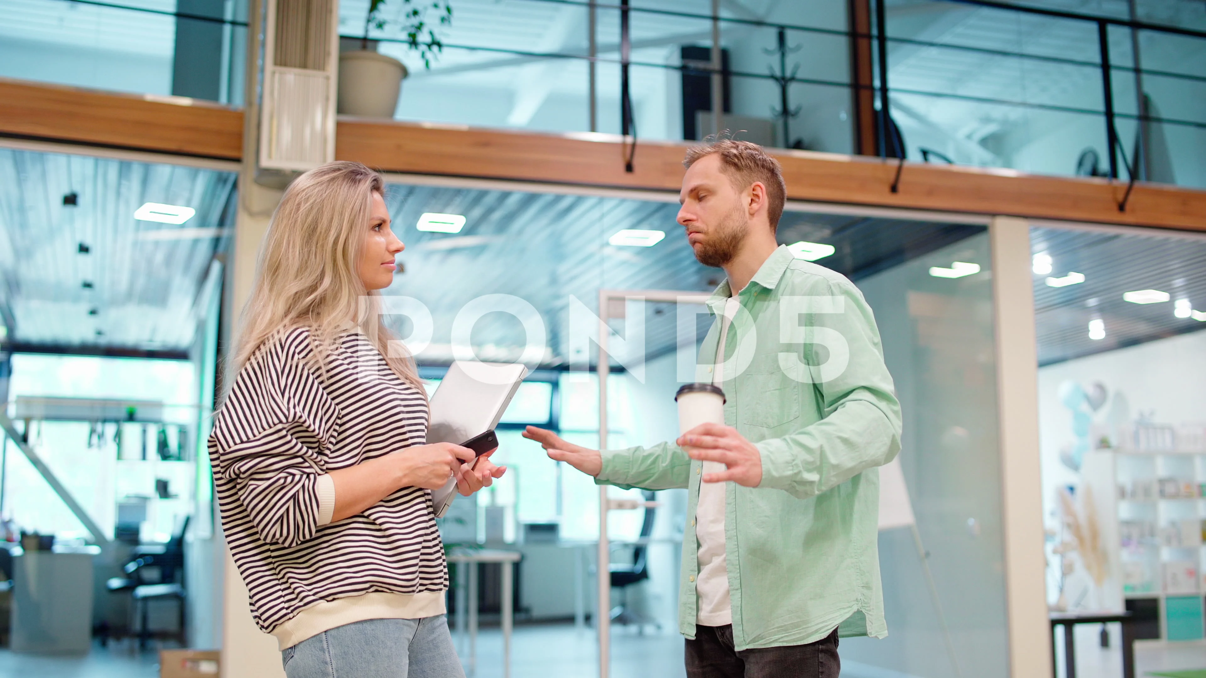 Two Business People Talking To Each Other