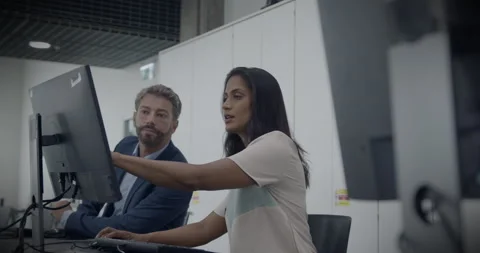 Two Business People using Computer in Co... | Stock Video | Pond5